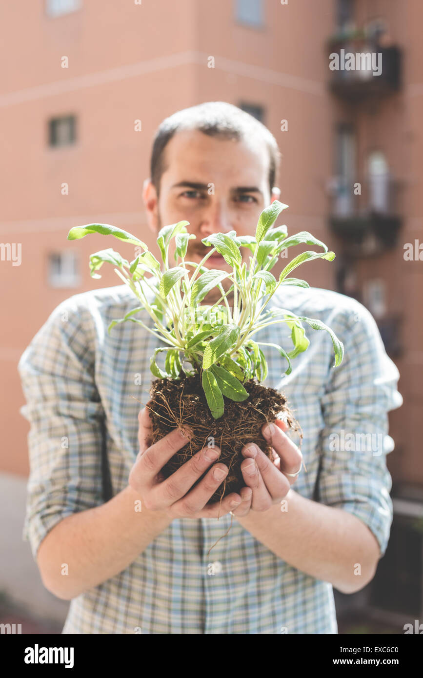 handsome stylish man gardening at home Stock Photo - Alamy