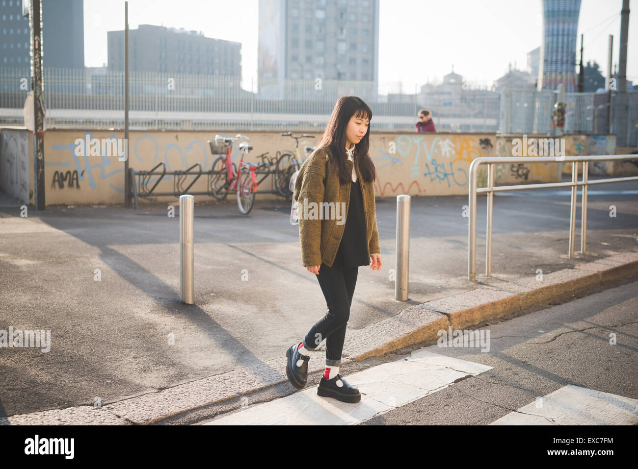 young beautiful asian hipster woman in the city - walking the street ...