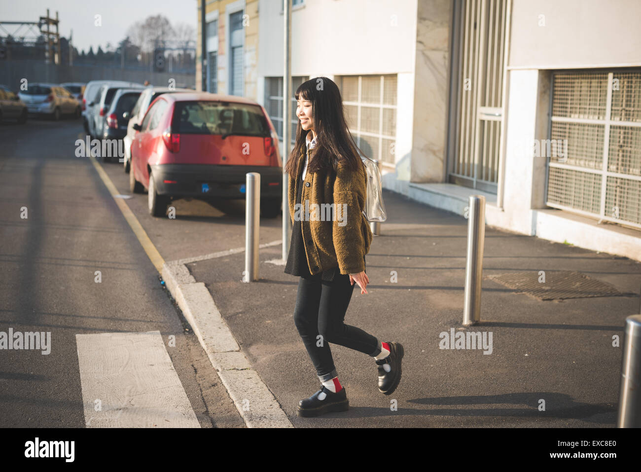young beautiful asian hipster woman in the city - walking the street ...