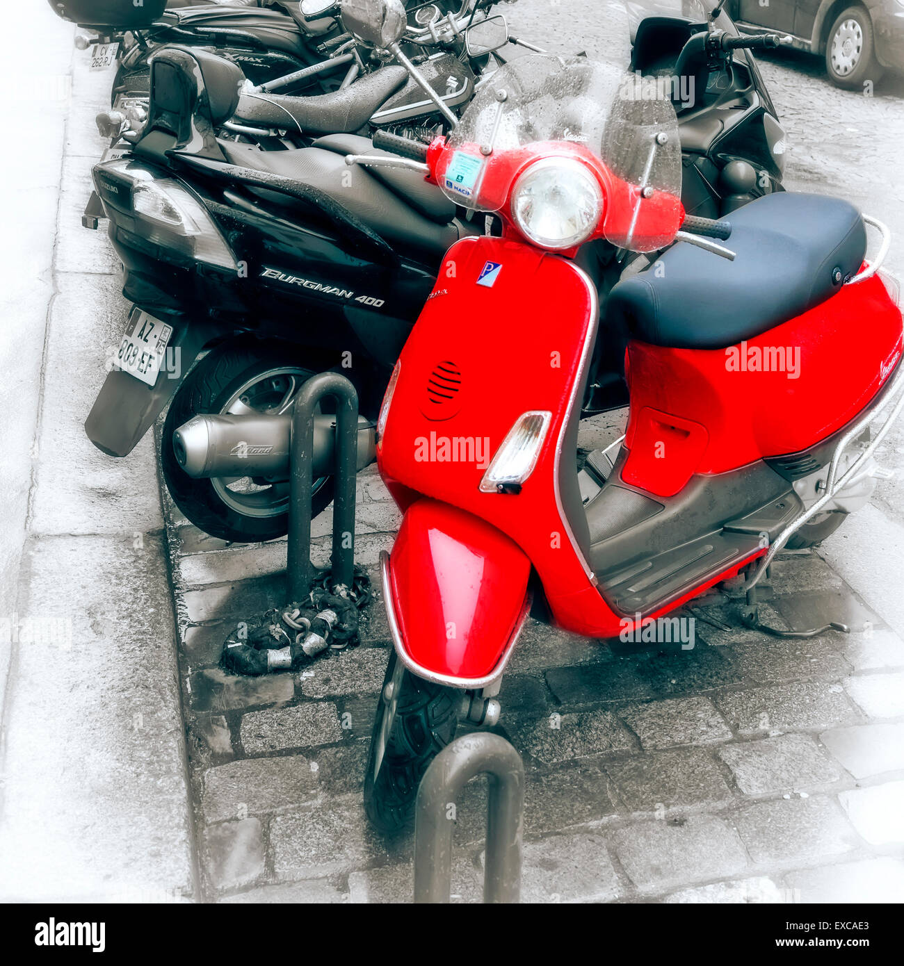 Red moped with a black and white background on a street in Paris Stock ...
