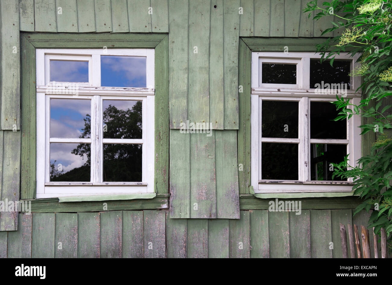 two old windows of a vintage wooden house Stock Photo - Alamy