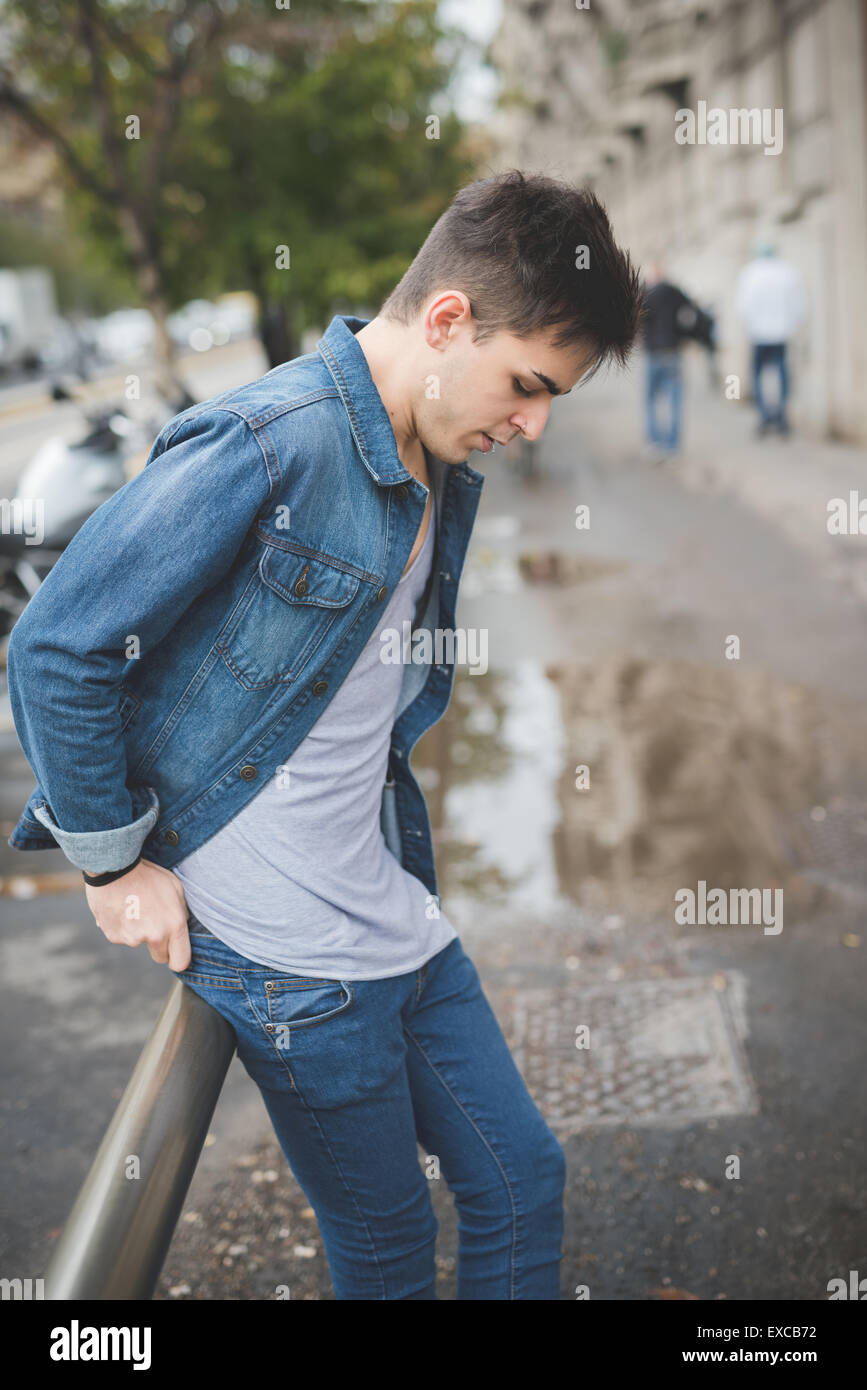 young handsome alternative dark model man in town Stock Photo - Alamy