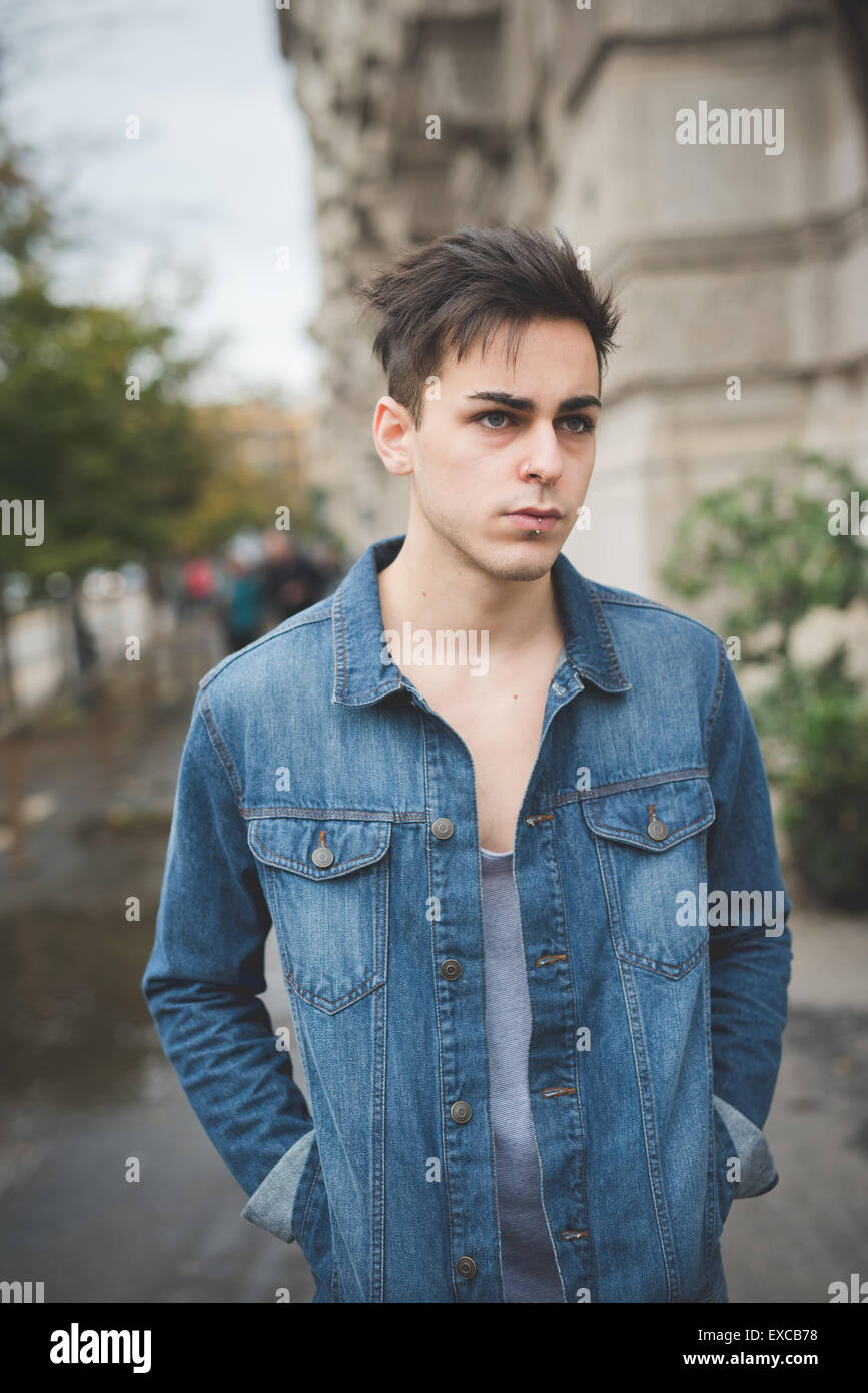 young handsome alternative dark model man in town Stock Photo - Alamy