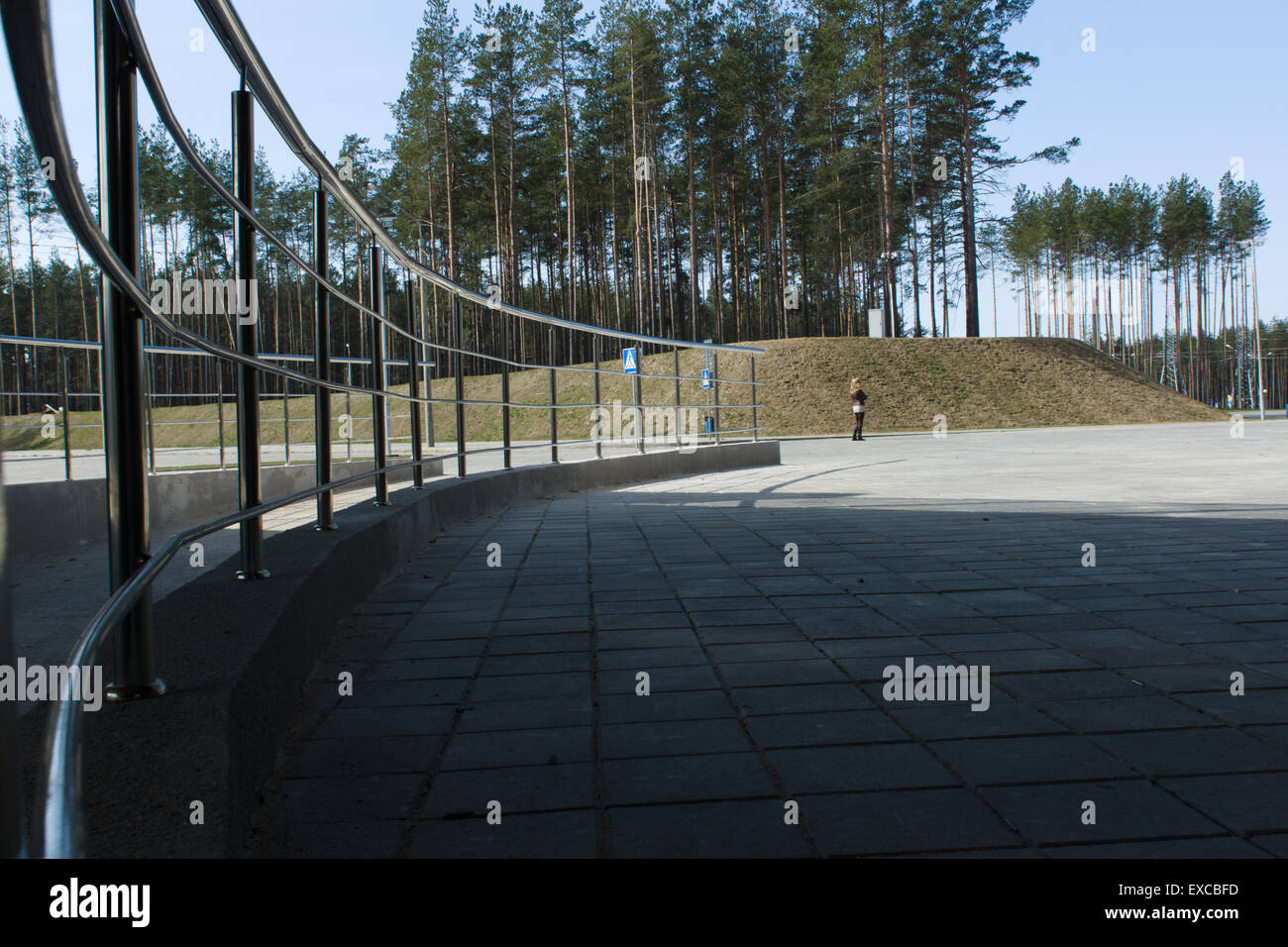 steel handrail located on an arch and removing a view of trees Stock ...