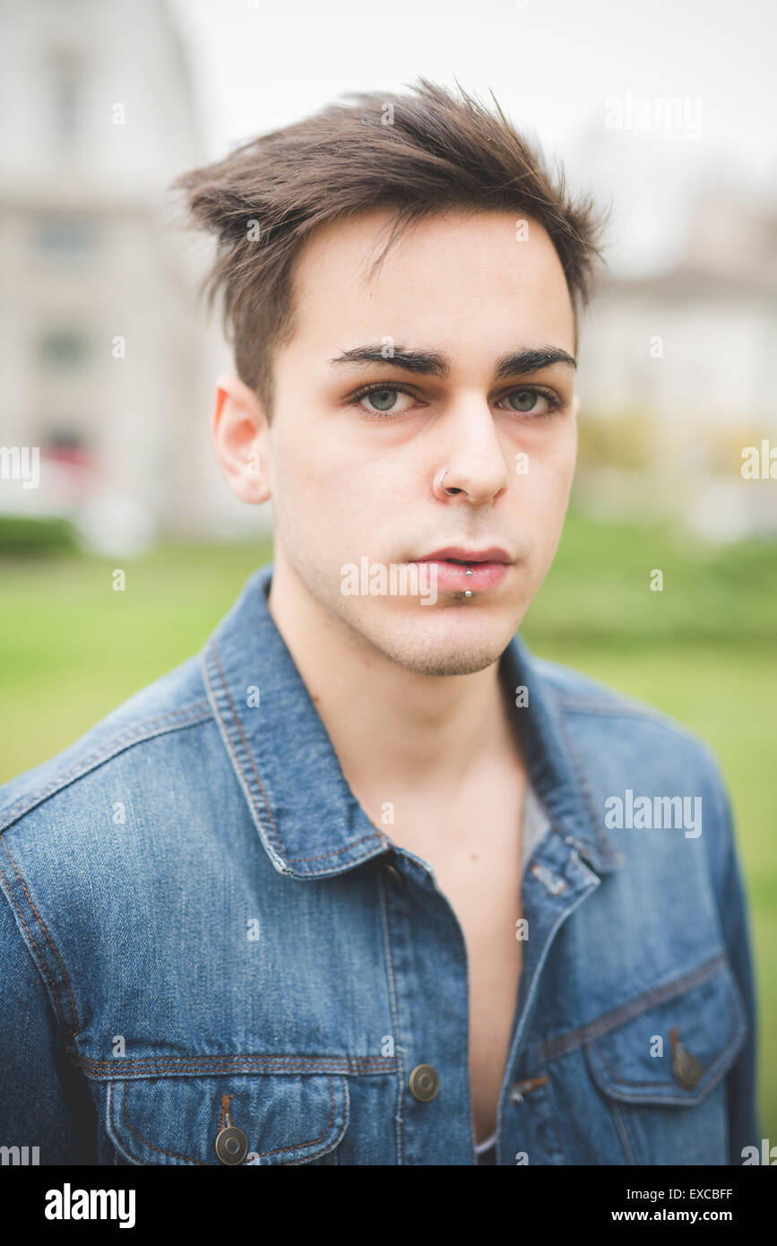 young handsome alternative dark model man in town Stock Photo - Alamy