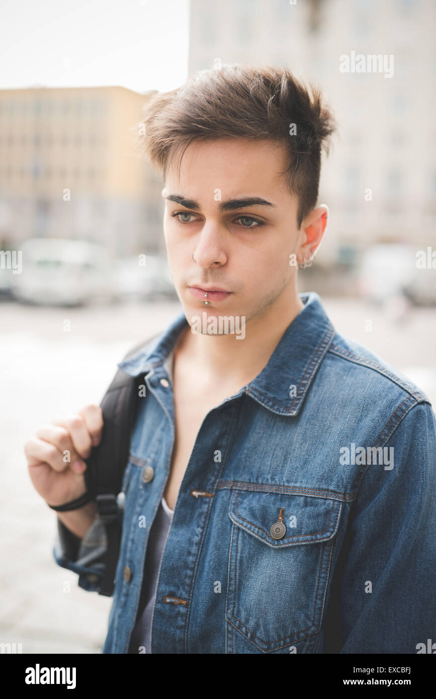 young handsome alternative dark model man in town Stock Photo - Alamy
