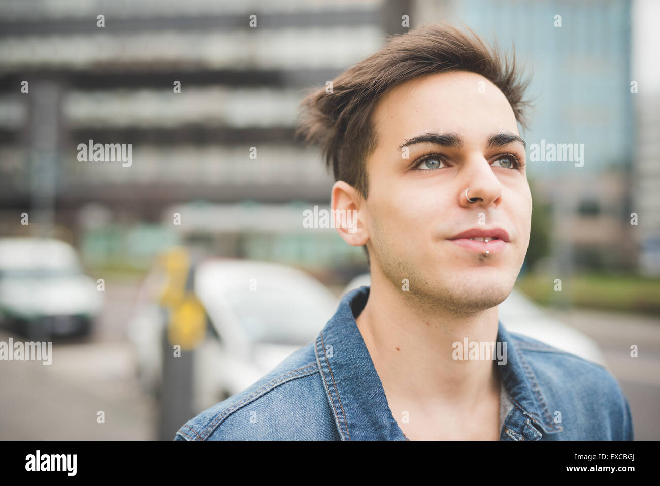young handsome alternative dark model man in town Stock Photo - Alamy