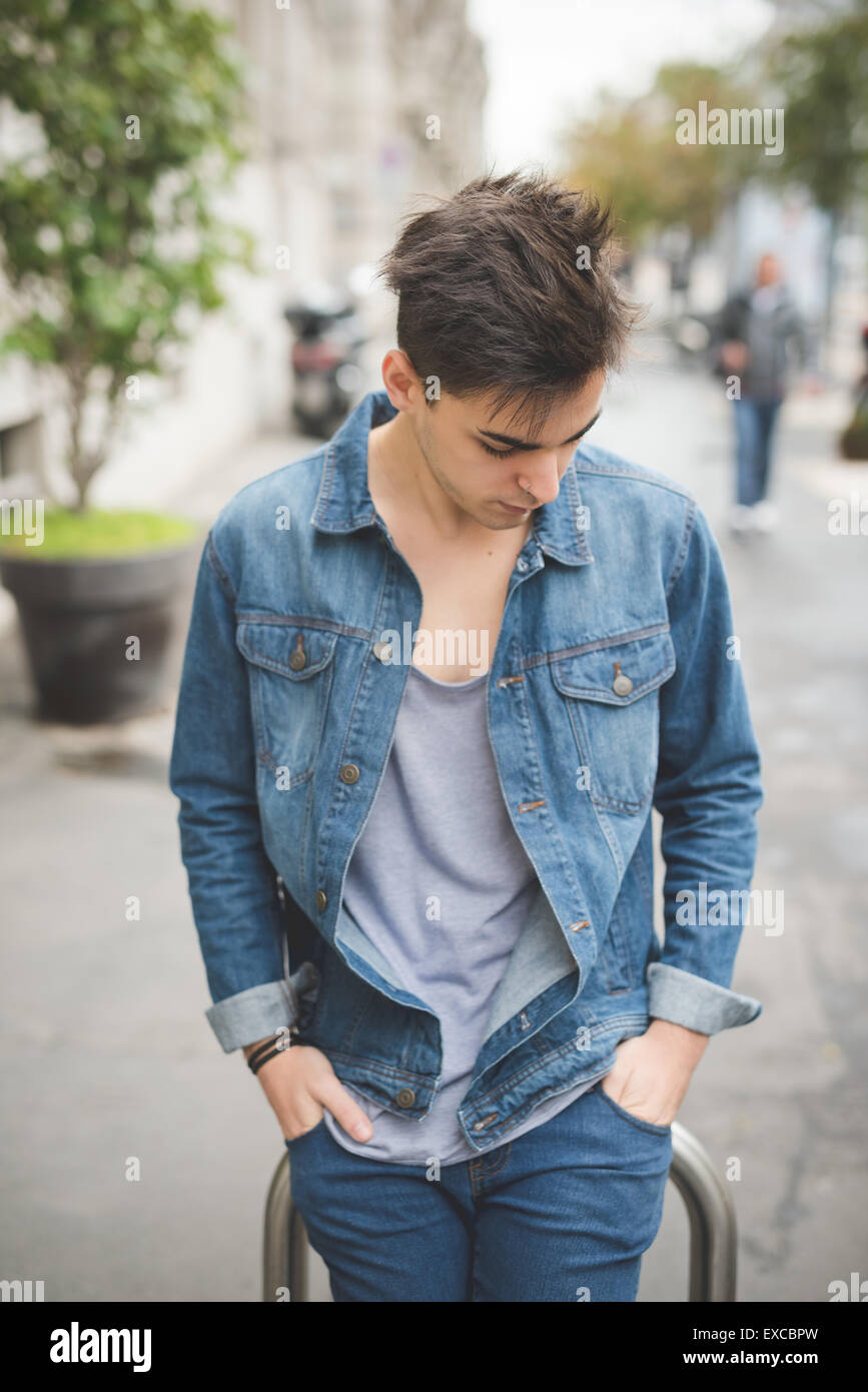 young handsome alternative dark model man in town Stock Photo - Alamy