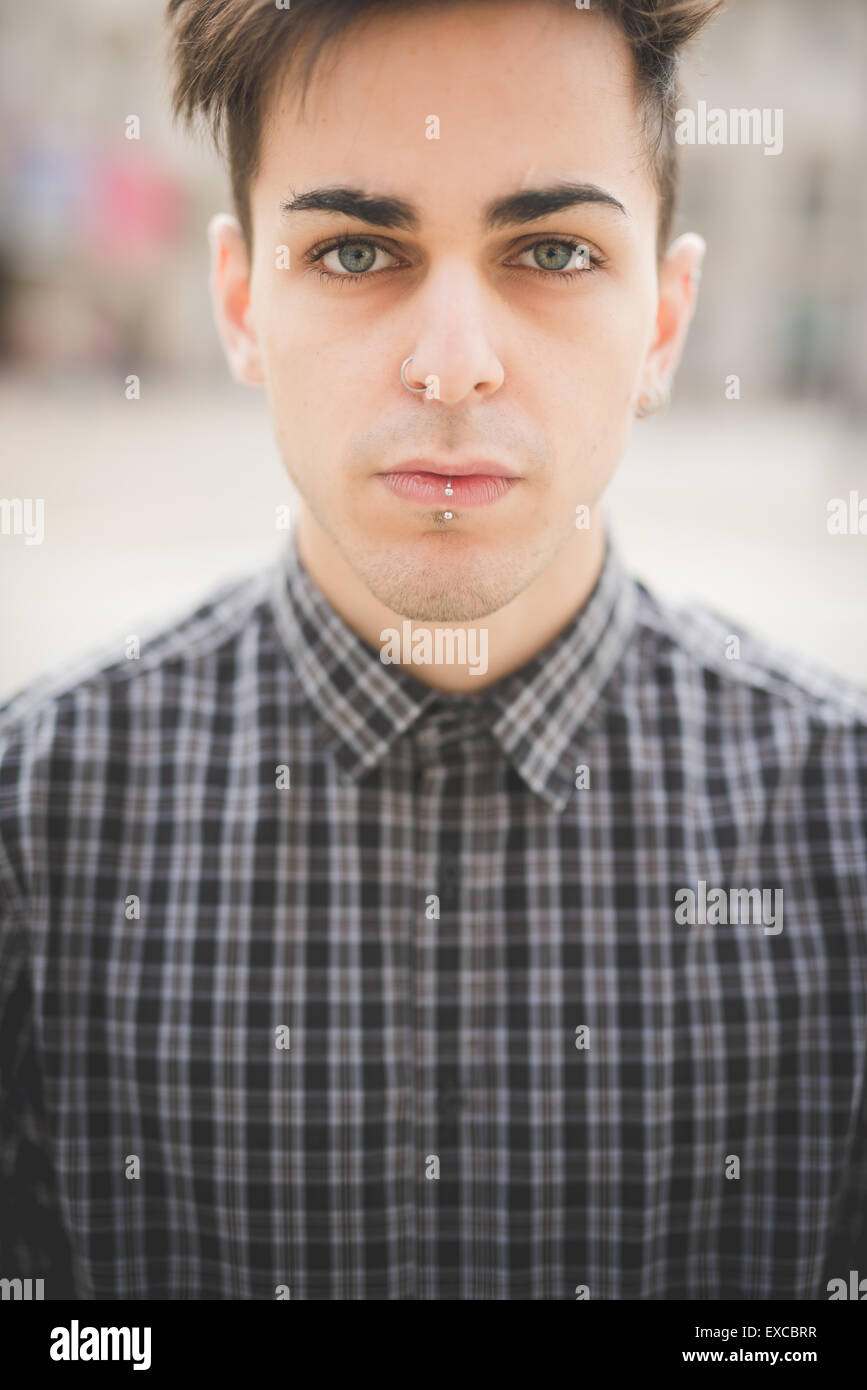 young handsome alternative dark model man in town Stock Photo - Alamy