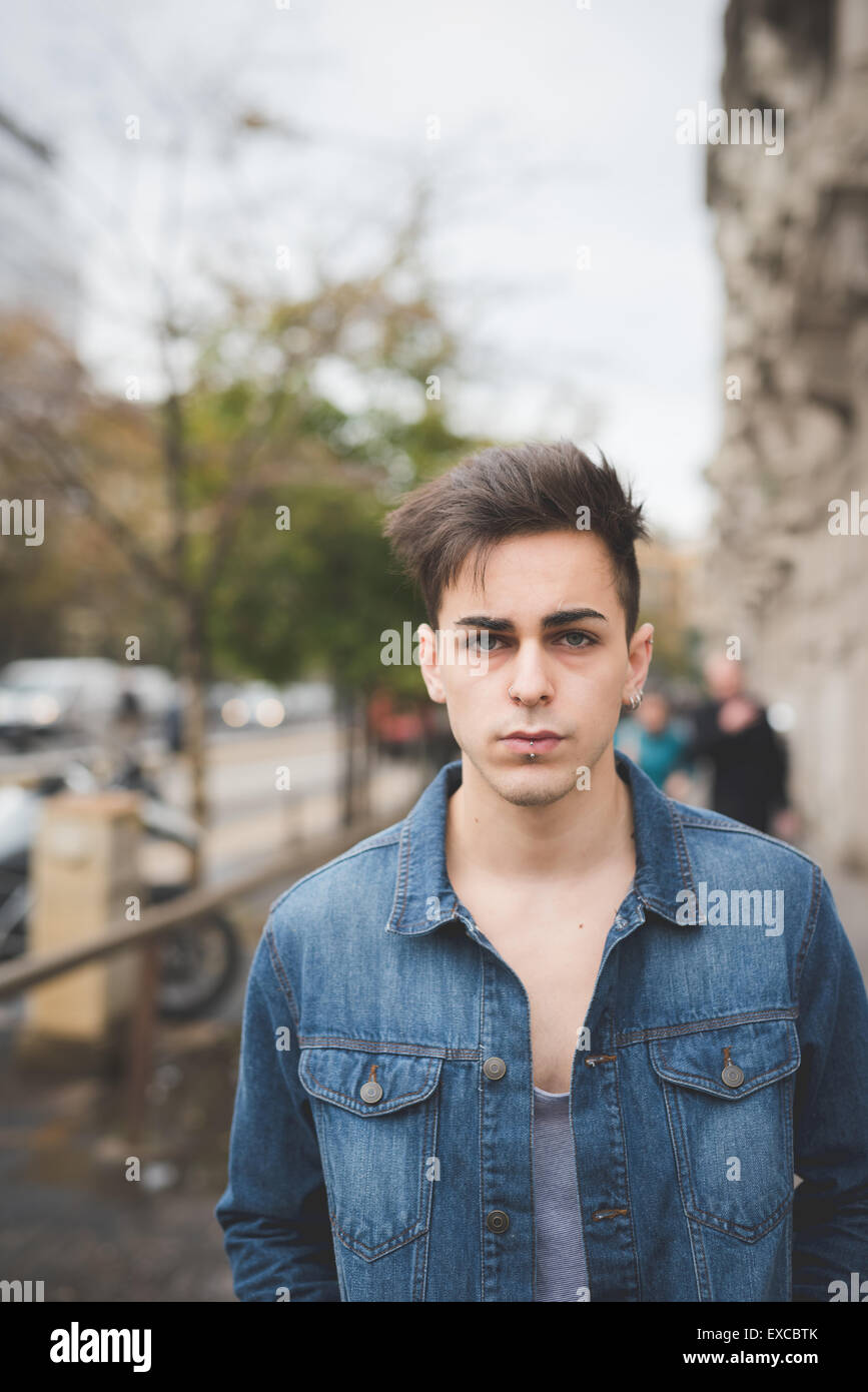 young handsome alternative dark model man in town Stock Photo - Alamy