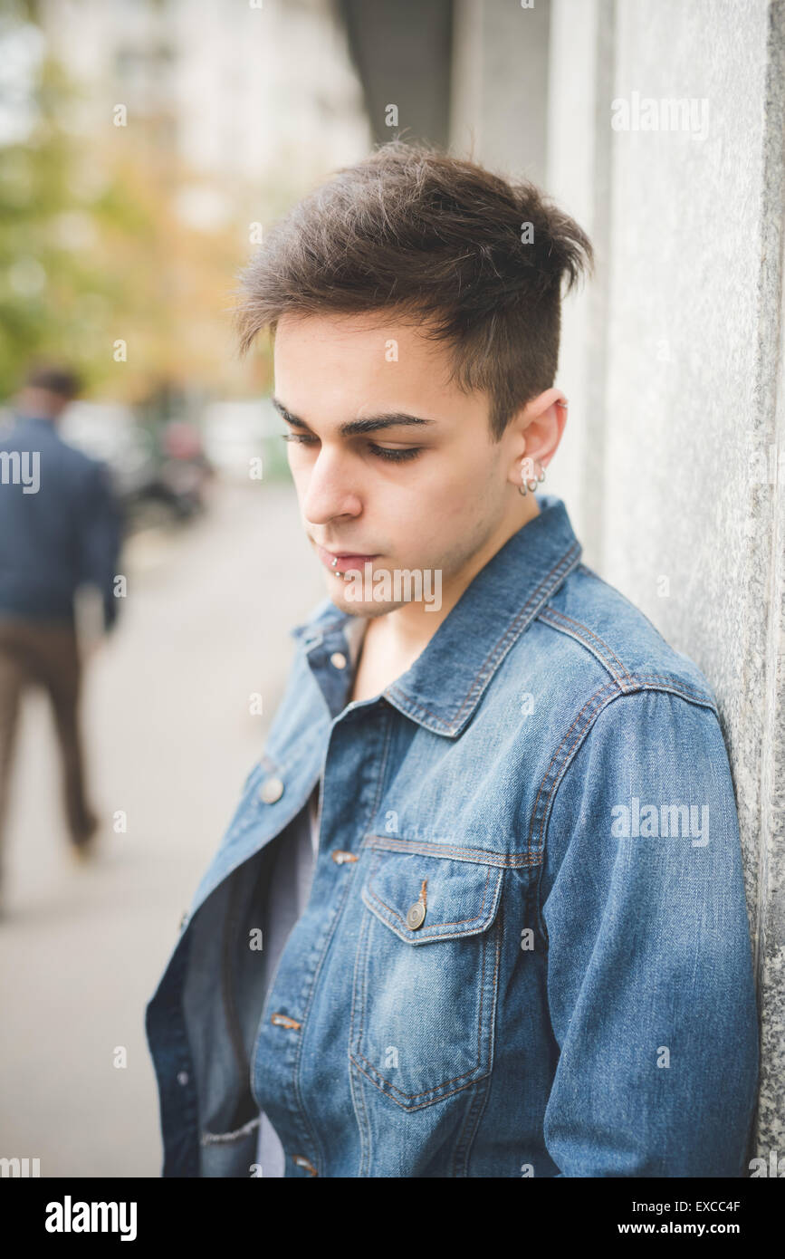 young handsome alternative dark model man in town Stock Photo - Alamy