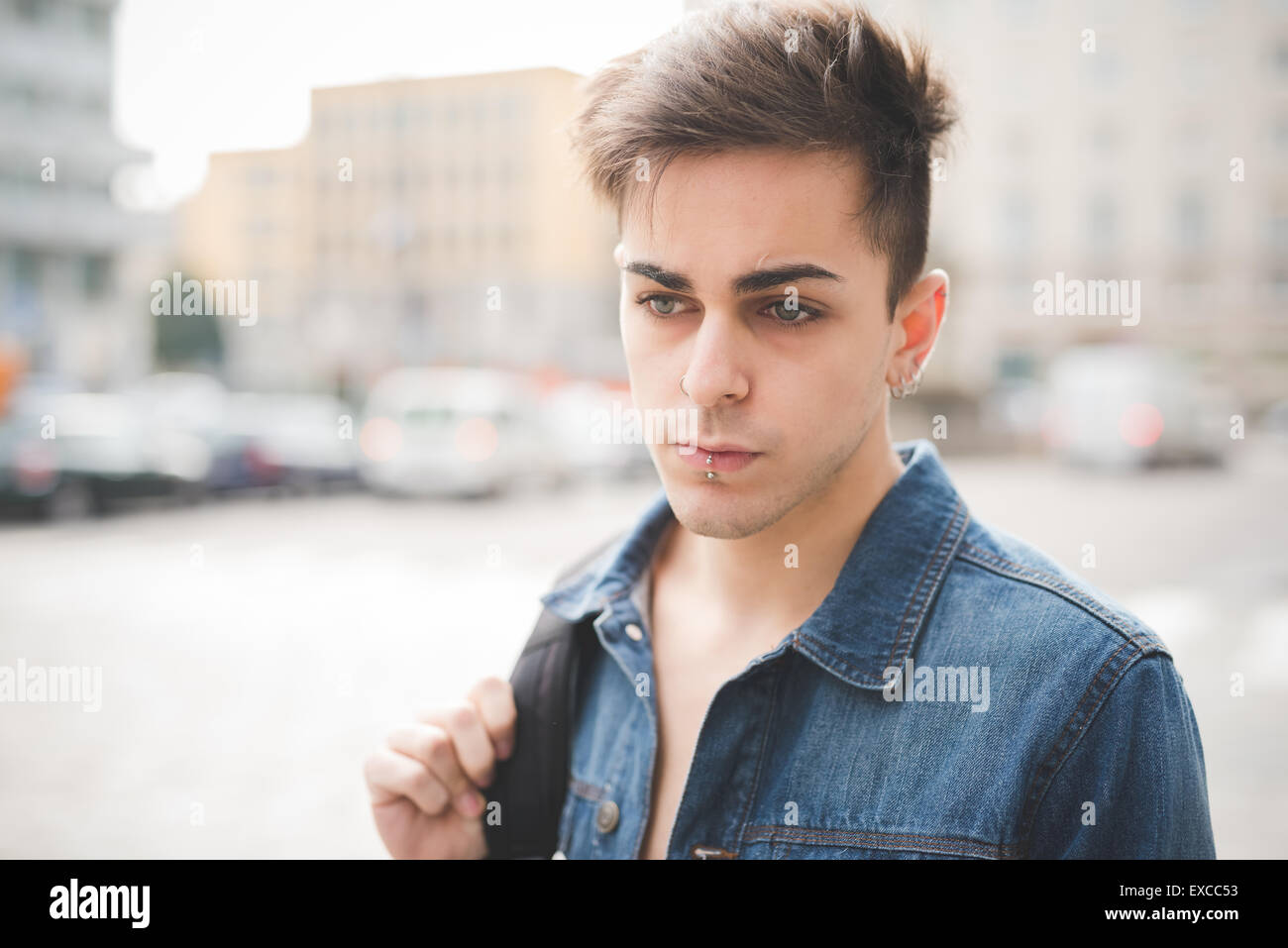 young handsome alternative dark model man in town Stock Photo - Alamy
