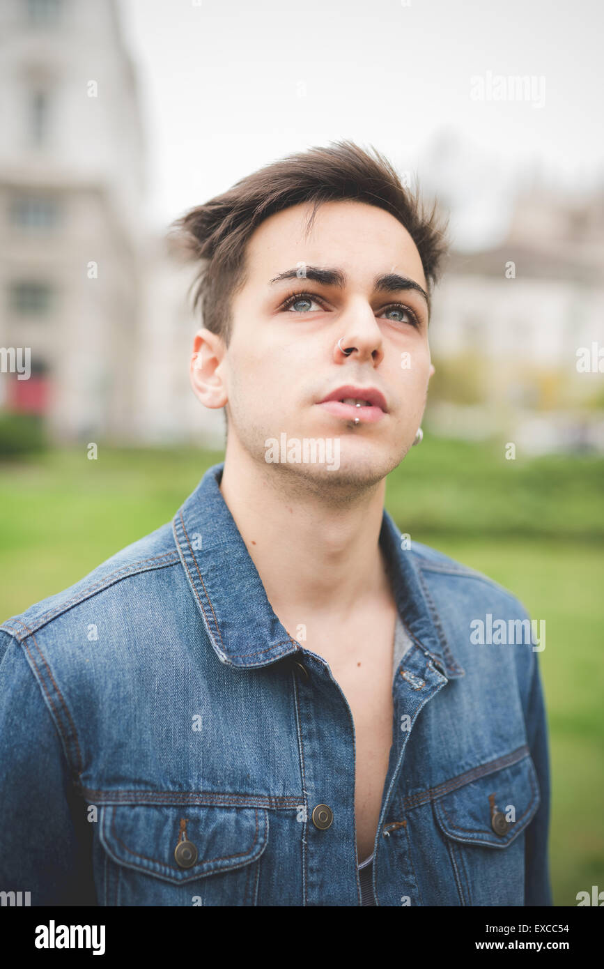 young handsome alternative dark model man in town Stock Photo - Alamy