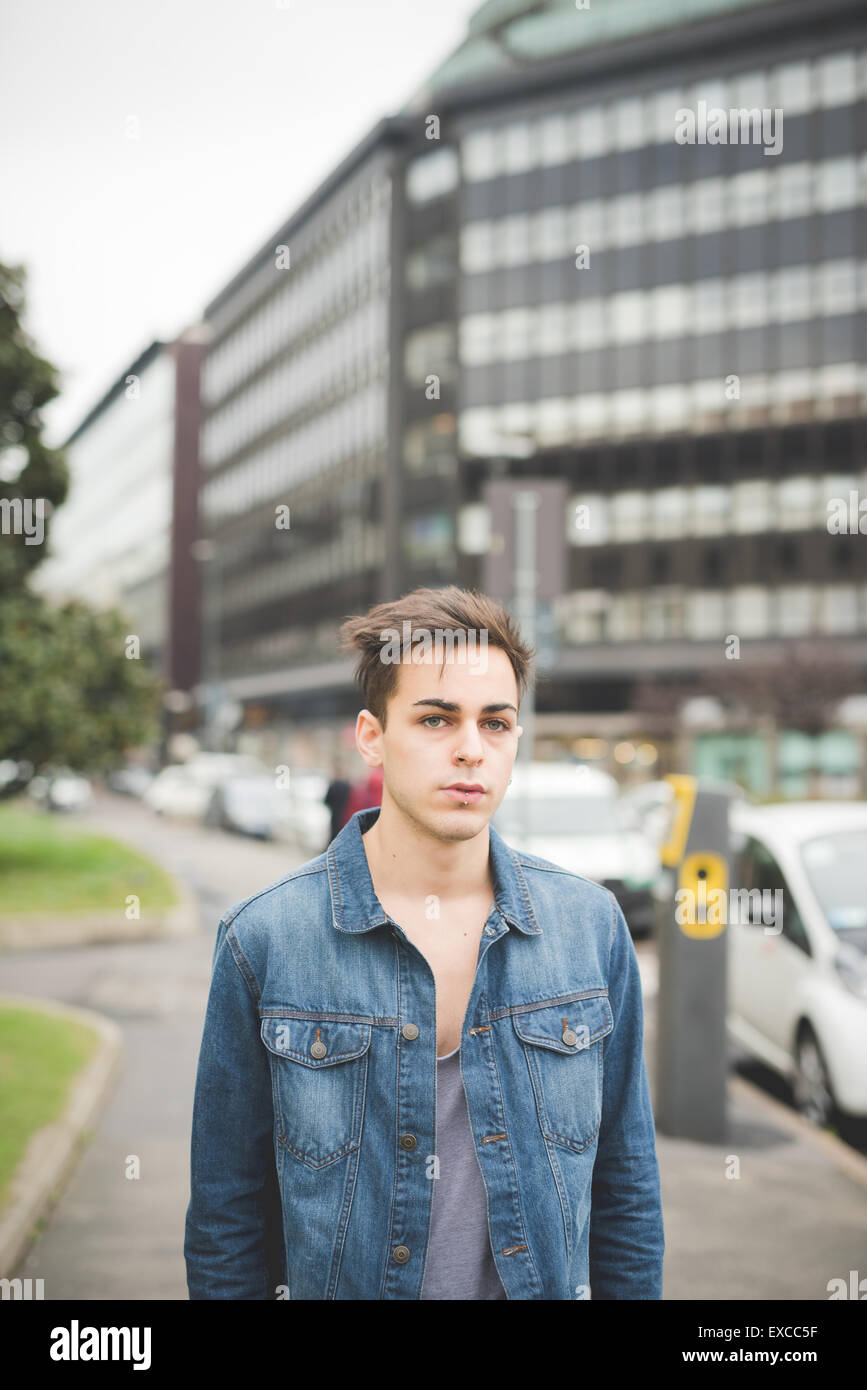 young handsome alternative dark model man in town Stock Photo - Alamy