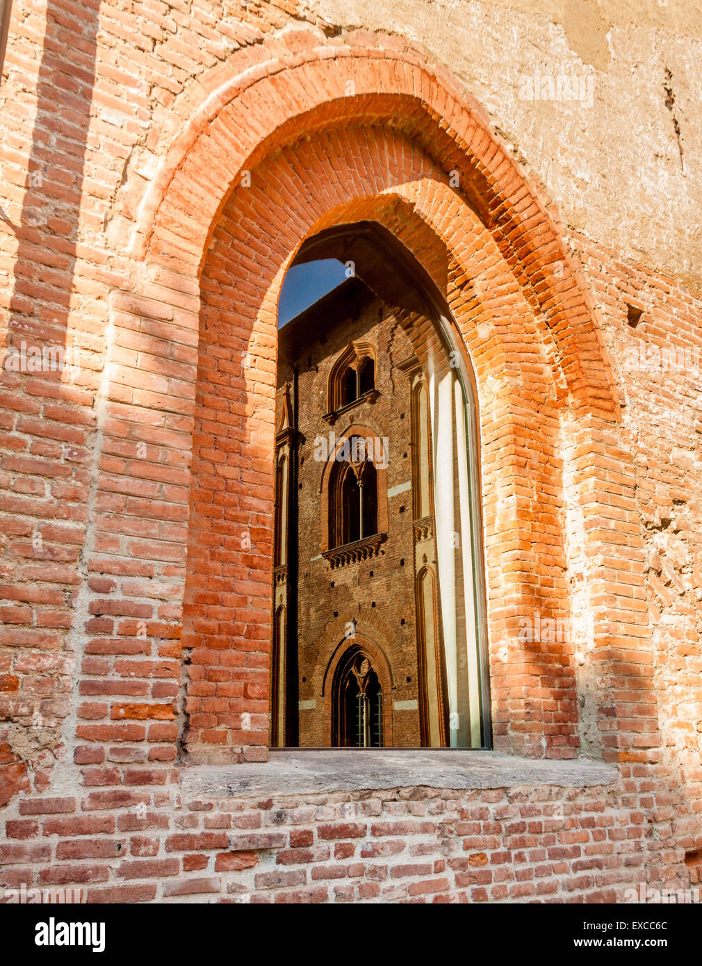 Visconti-Sforza castle in Vigevano. Building reflected in a window ...