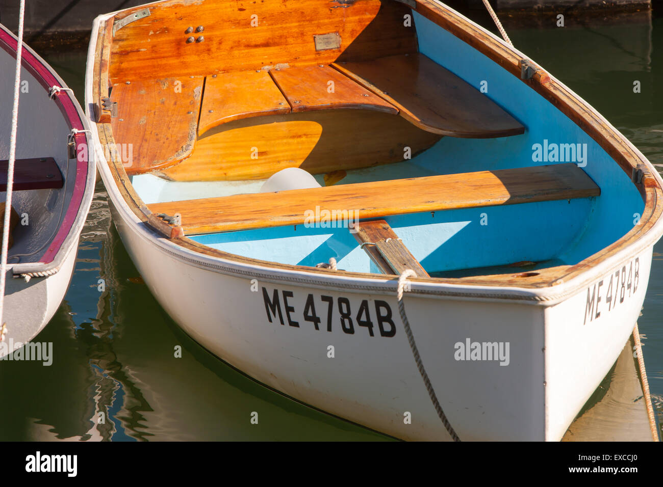 Wooden dinghies anchored in the harbor in Rockport, Maine Stock Photo ...