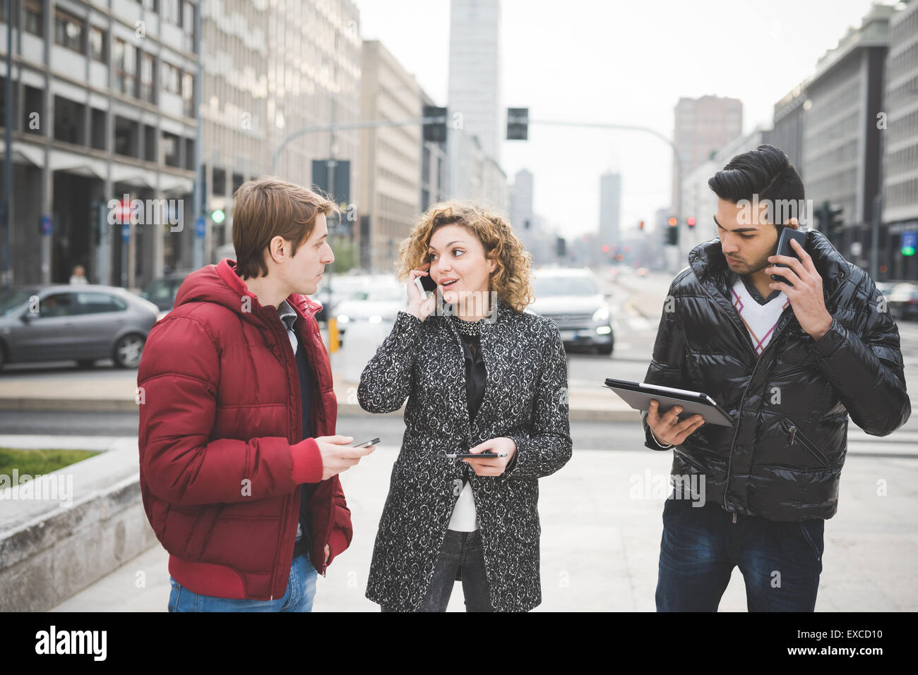 Multiracial business people working outdoor in town connected with ...