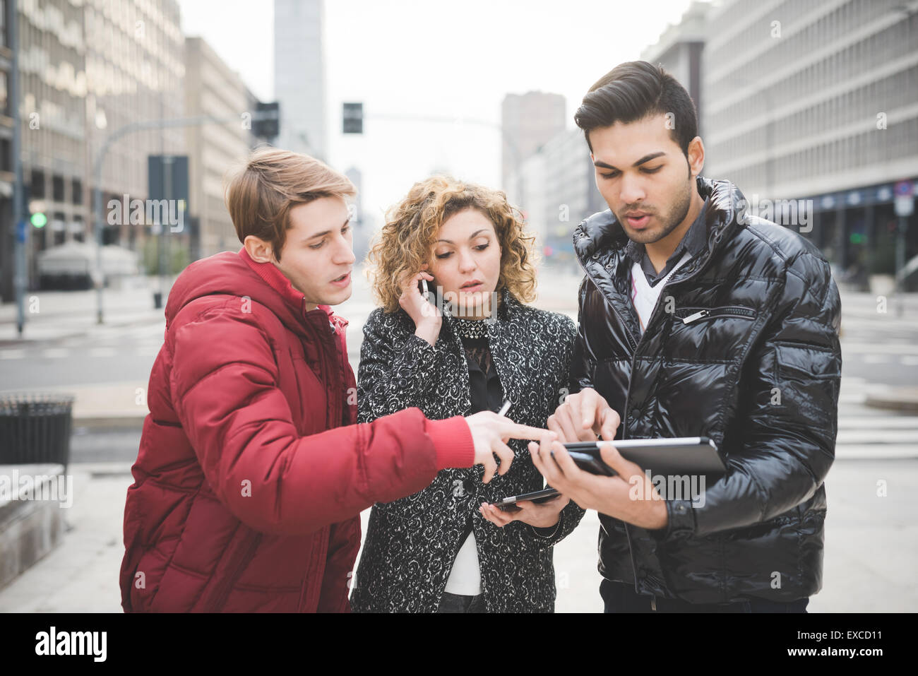 Multiracial business people working outdoor in town connected with ...