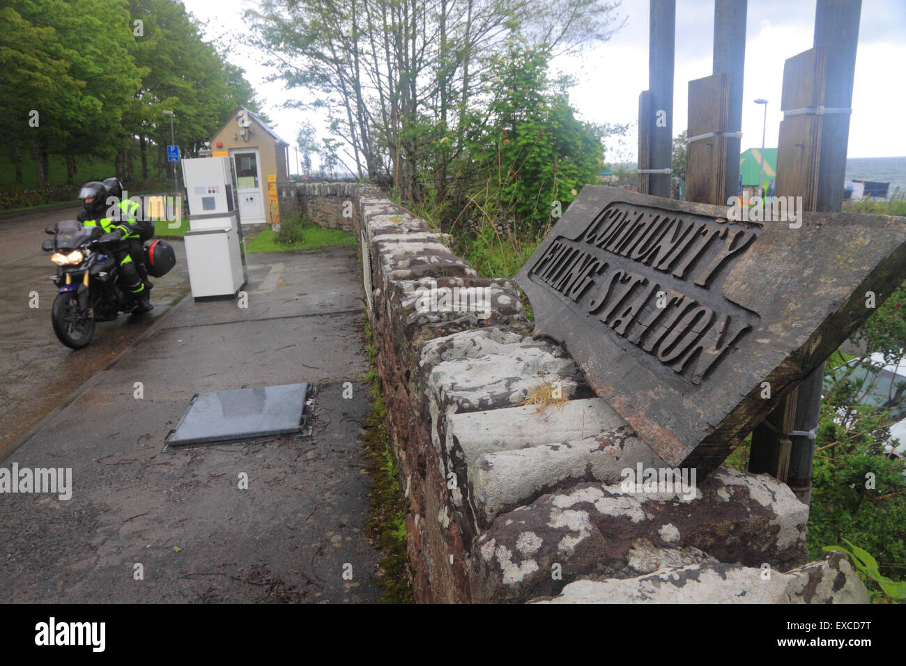 Motorcycle at the community filling station in Applecross, Scotland, UK ...