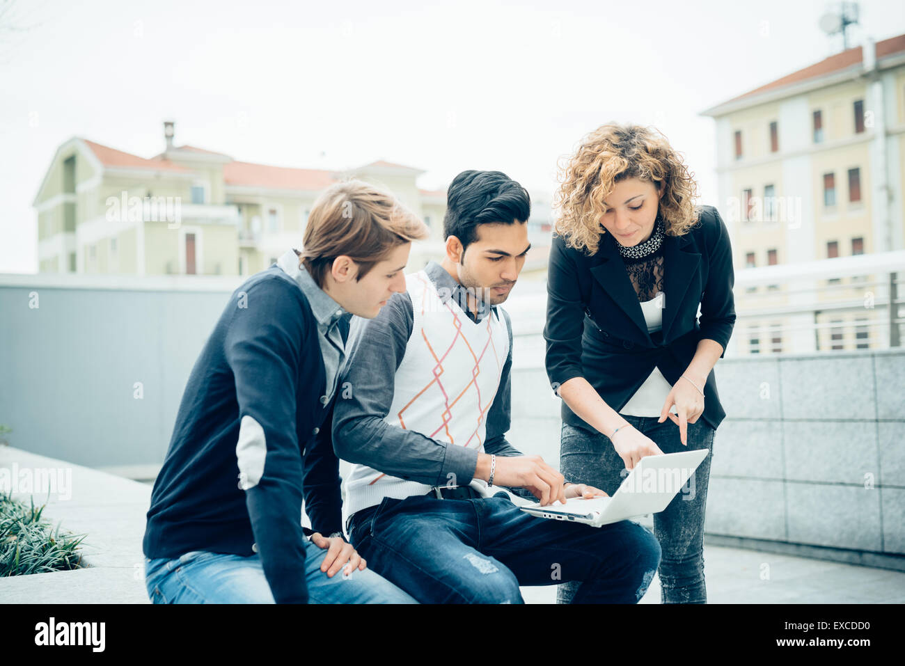 Multiracial business people working outdoor in town connected with ...