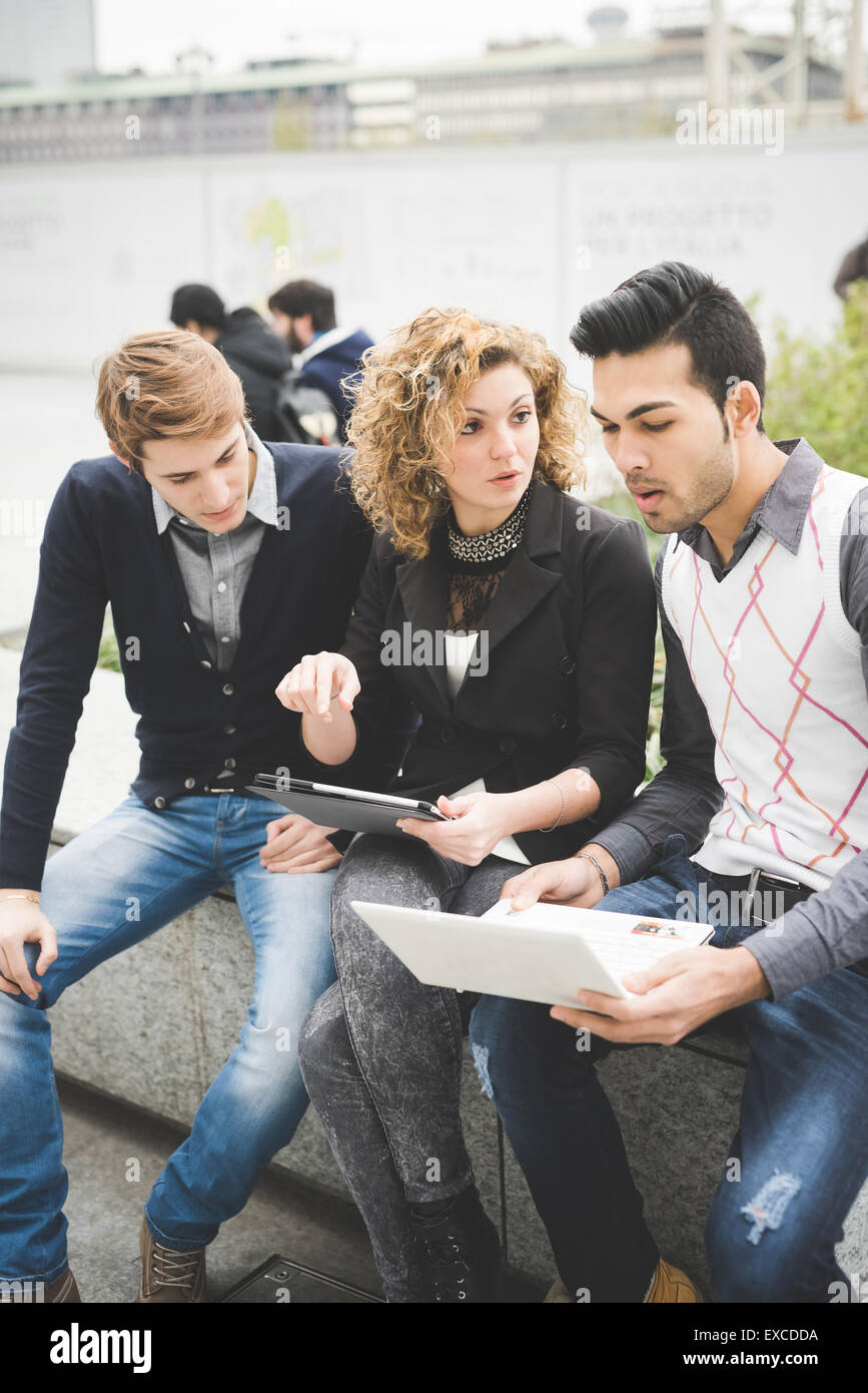 Multiracial business people working outdoor in town connected with ...