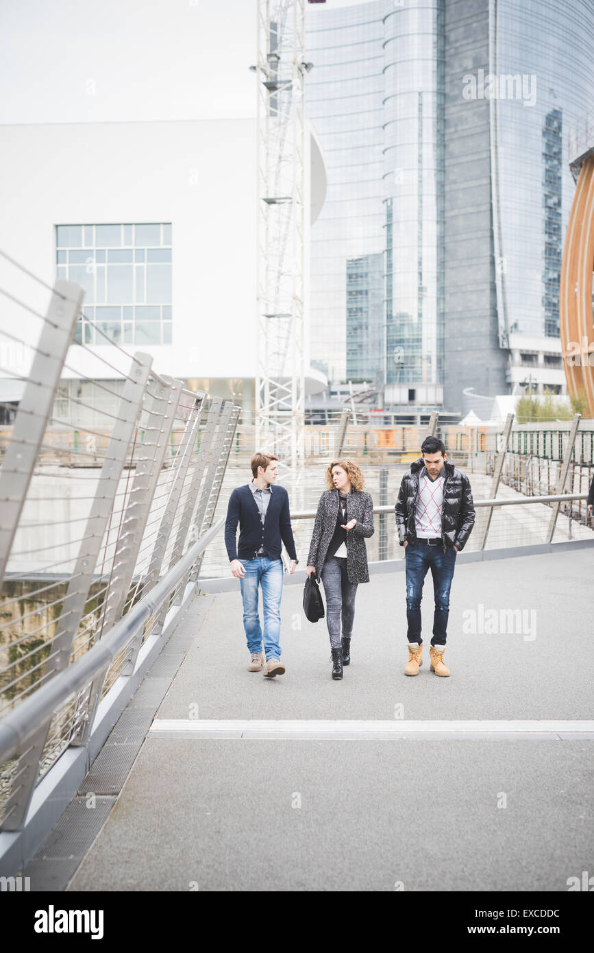 Multiracial business people working outdoor in town connected with ...