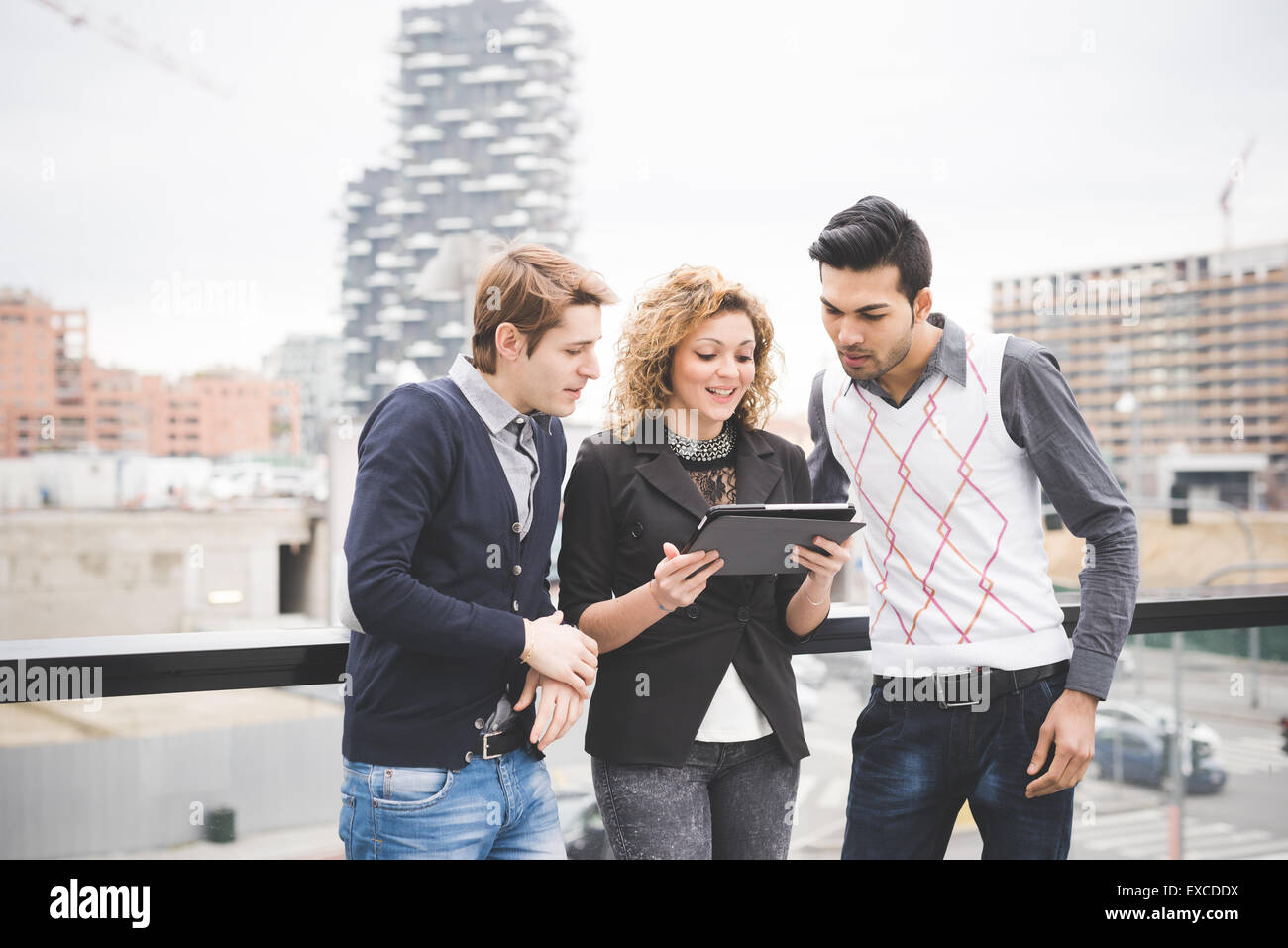Multiracial business people working outdoor in town connected with ...