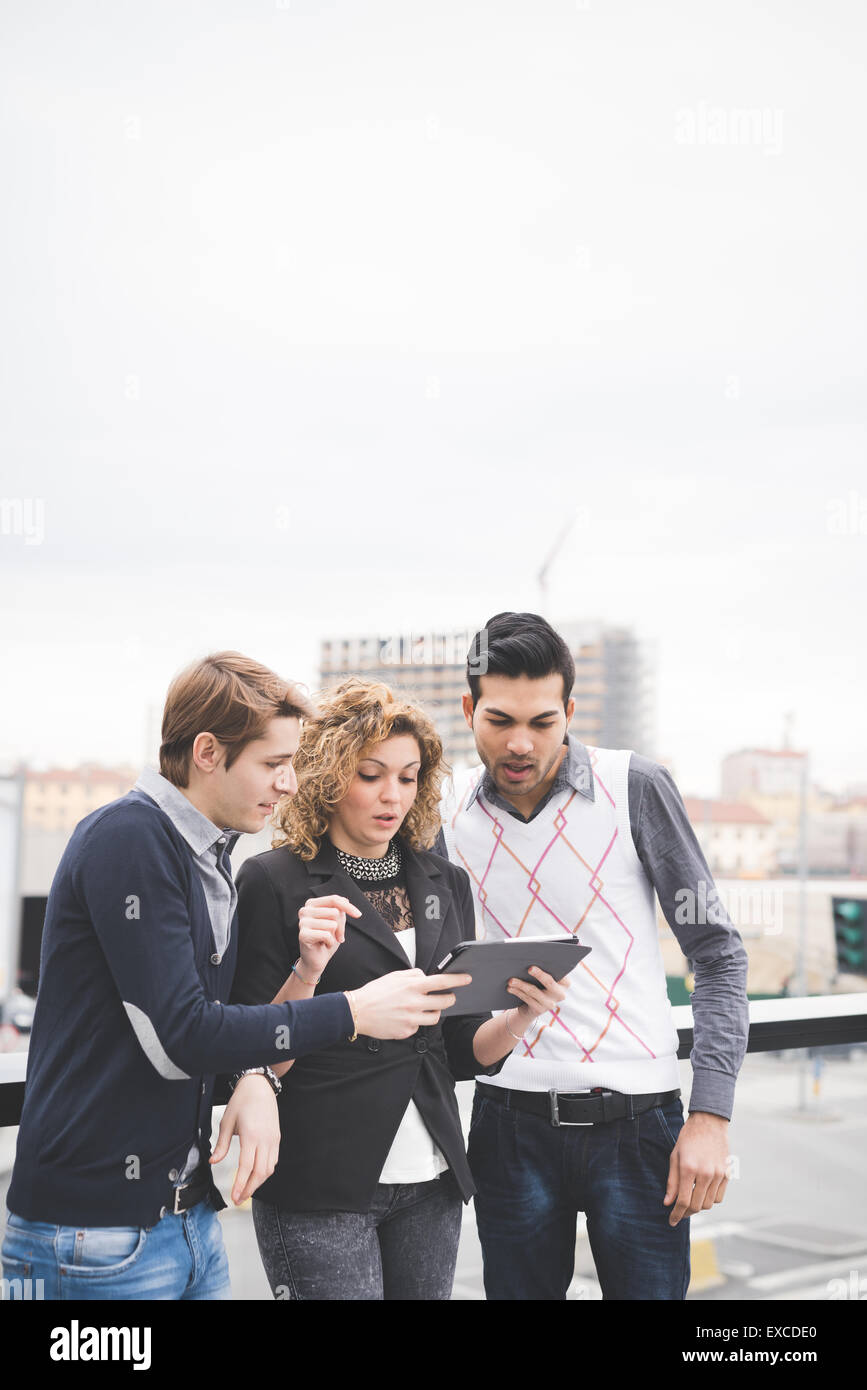 Multiracial business people working outdoor in town connected with ...