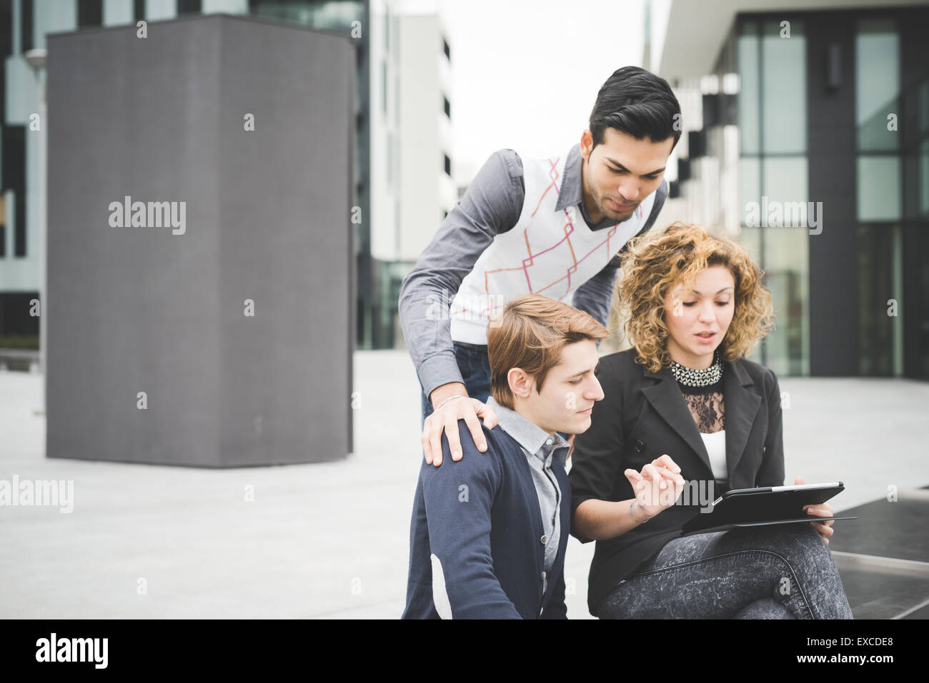 Multiracial business people working outdoor in town connected with ...