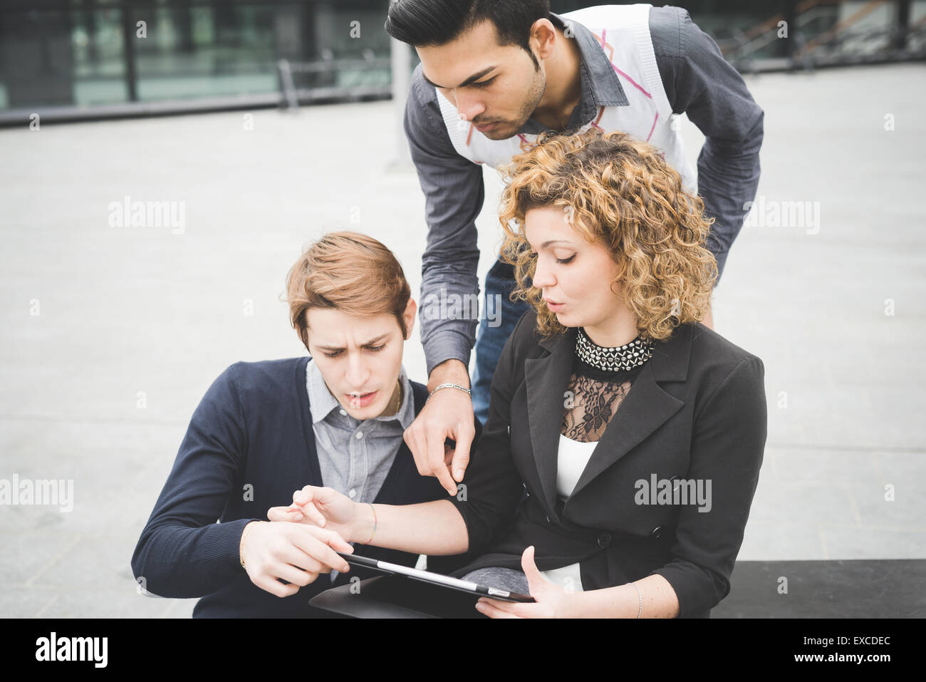 Multiracial business people working outdoor in town connected with ...