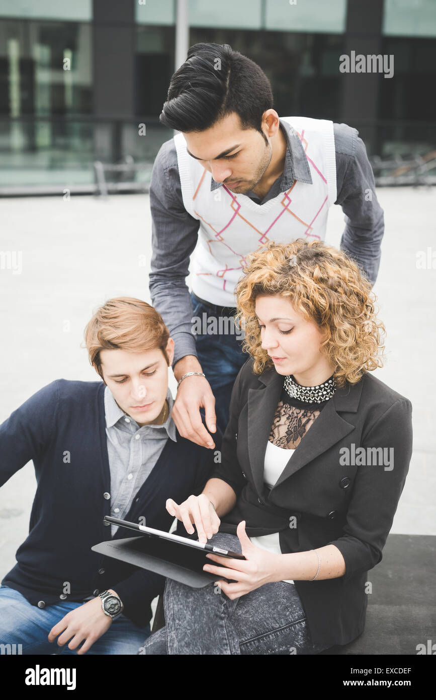 Multiracial business people working outdoor in town connected with ...