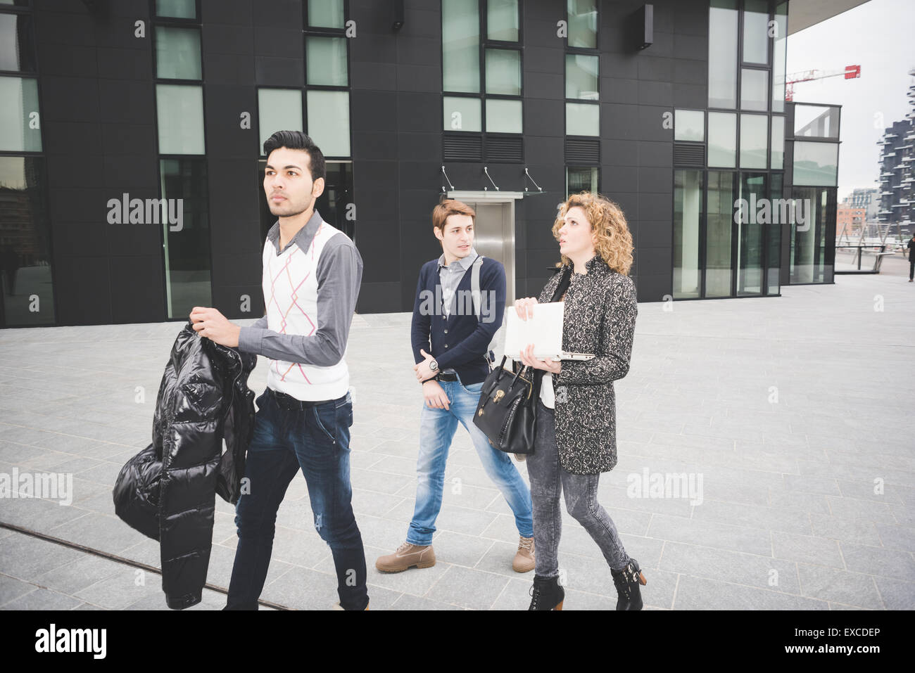 Multiracial business people working outdoor in town connected with ...