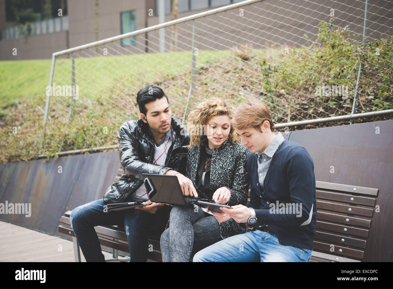 Multiracial business people working outdoor in town connected with ...