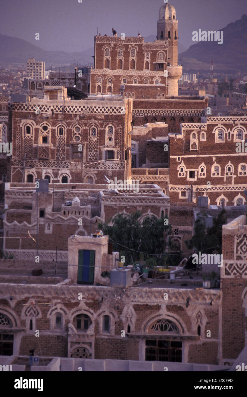 Old city of Sana'a skyline at sunset with multi-storey buildings ...