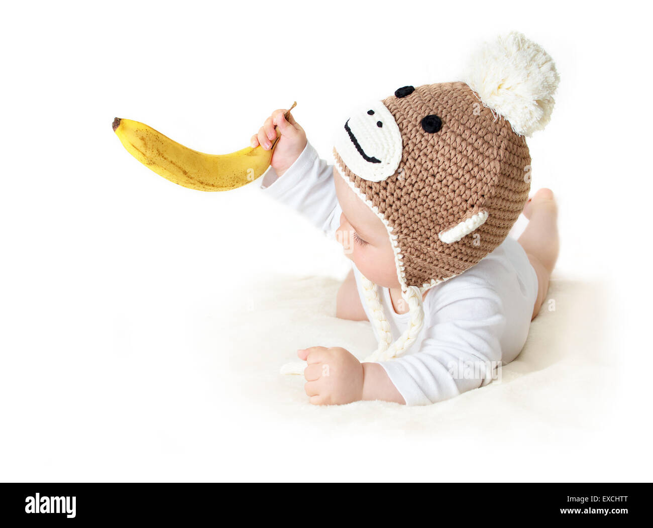 Baby in monkey hat Stock Photo - Alamy