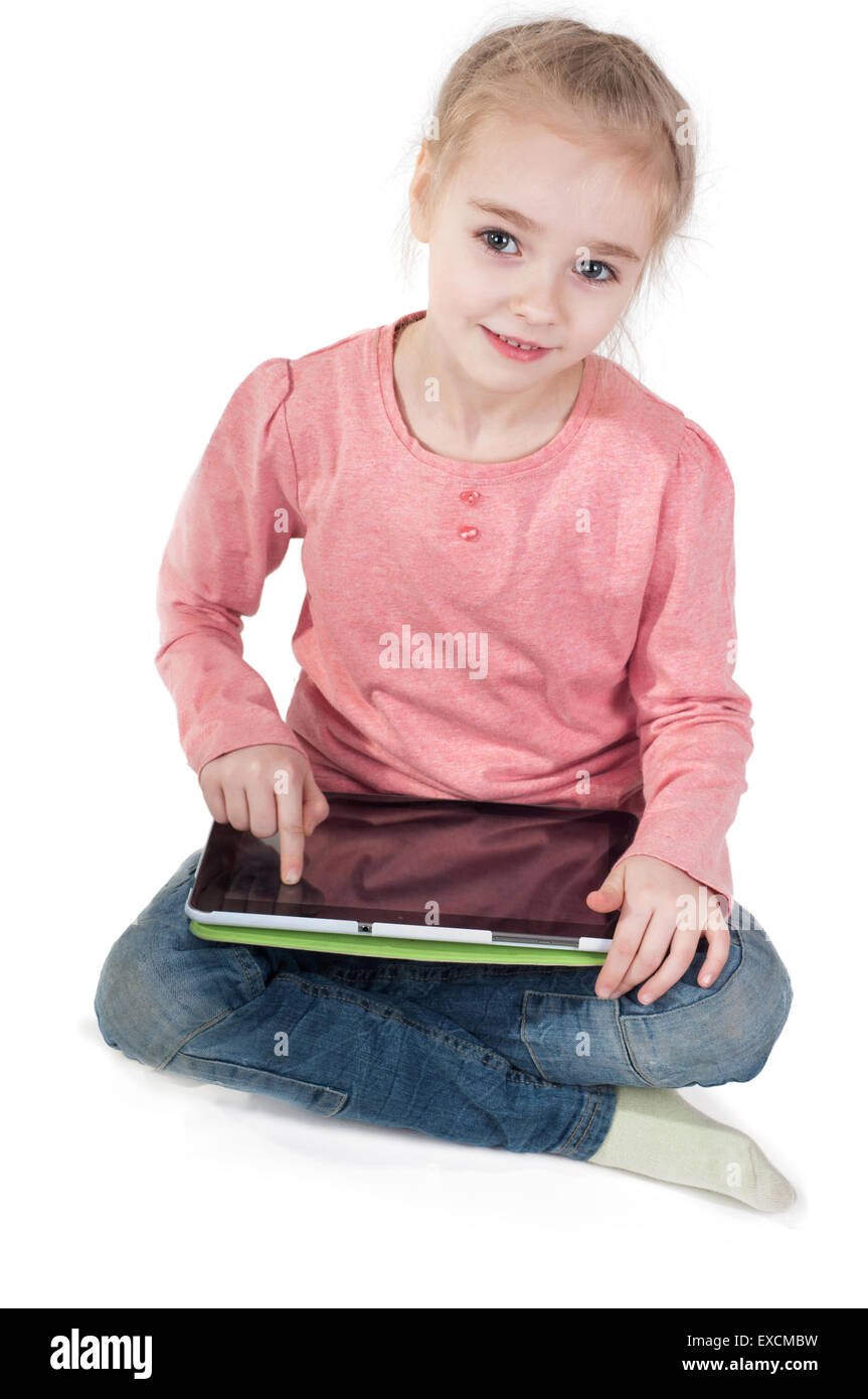 Little girl uses a tablet PC Stock Photo - Alamy