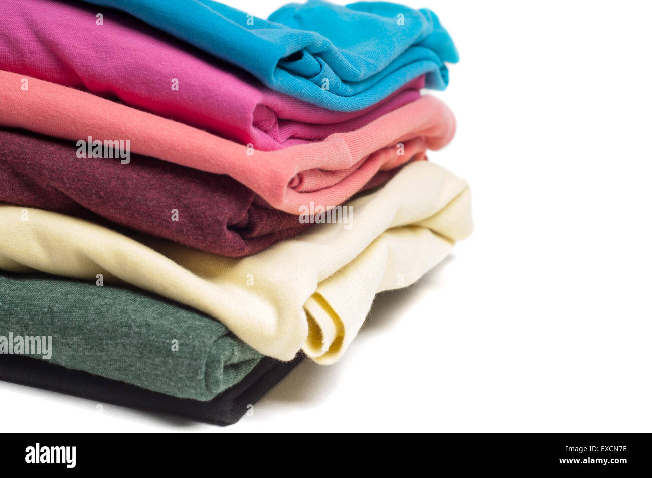 Closeup of pile of folded T shirts Stock Photo - Alamy