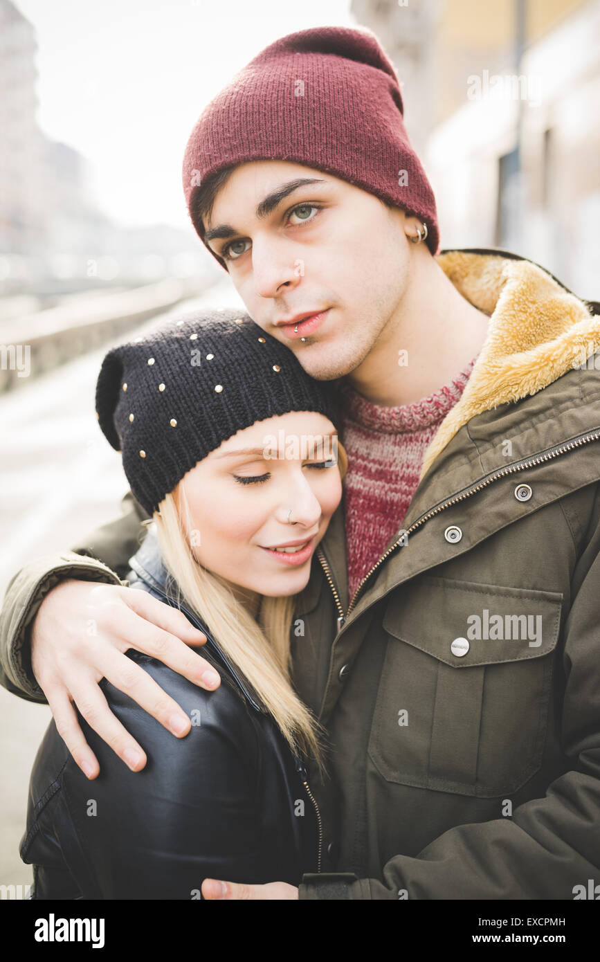 young beautiful couple lovers hugging in the street Stock Photo - Alamy