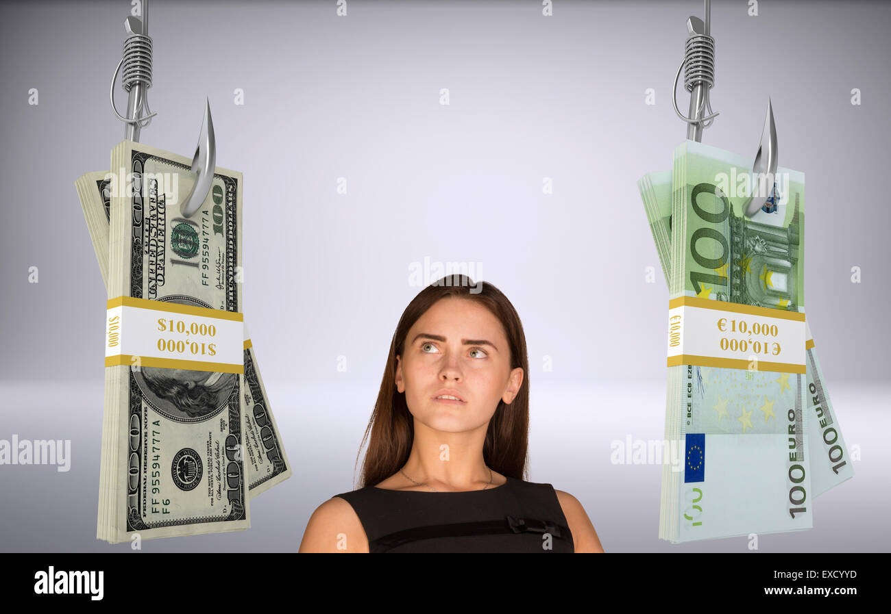 Businesslady looking at money Stock Photo - Alamy