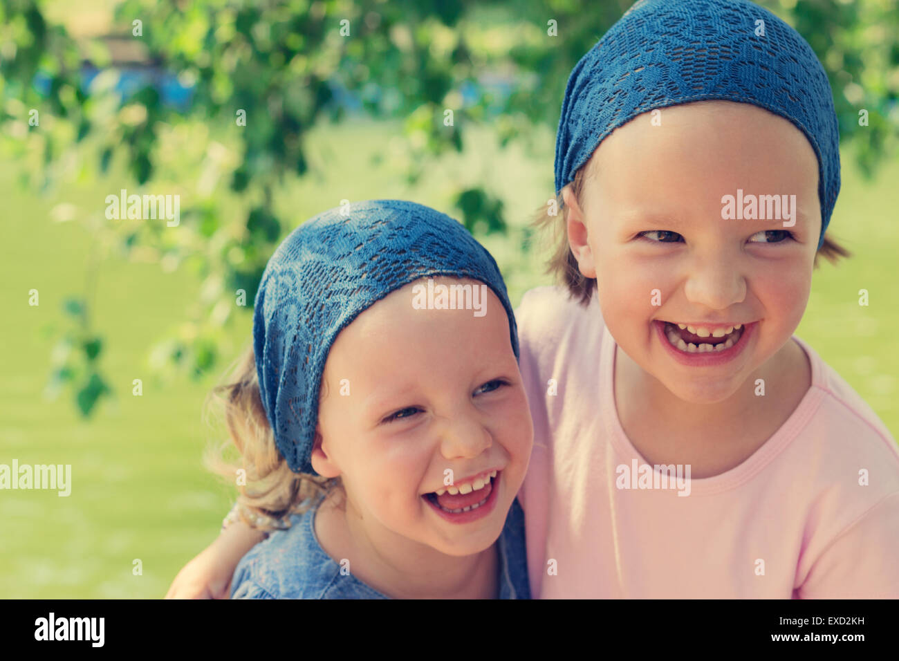 Small cute funny girls (sisters) laugh, selective focus Stock Photo - Alamy