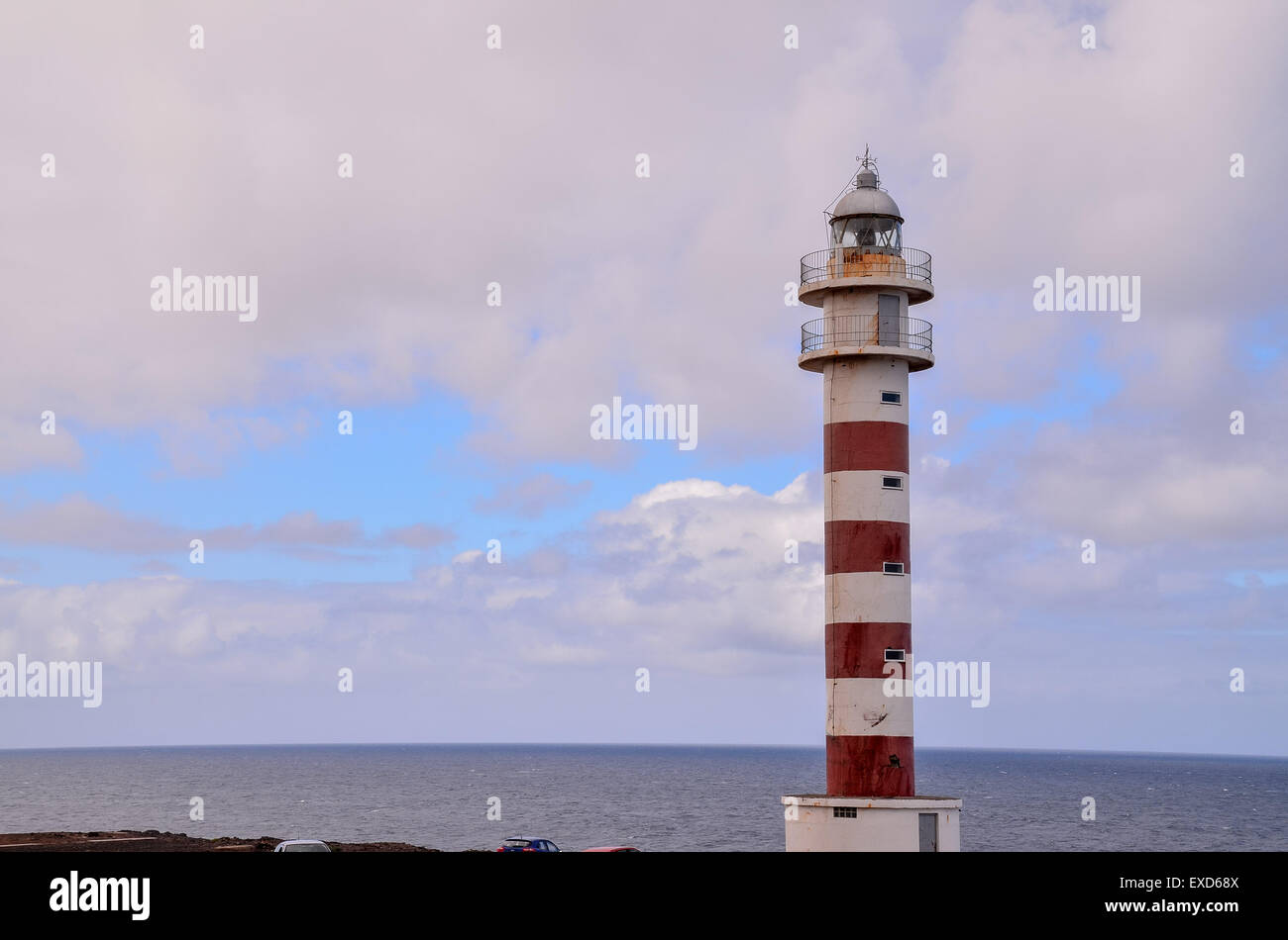 High Lighthouse near the Coast Stock Photo - Alamy