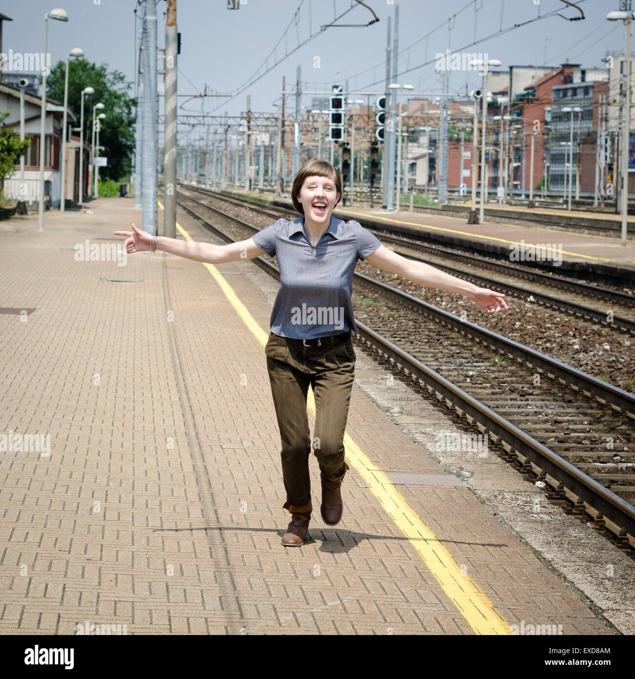 young beautiful hipster woman happy running in the station Stock Photo ...