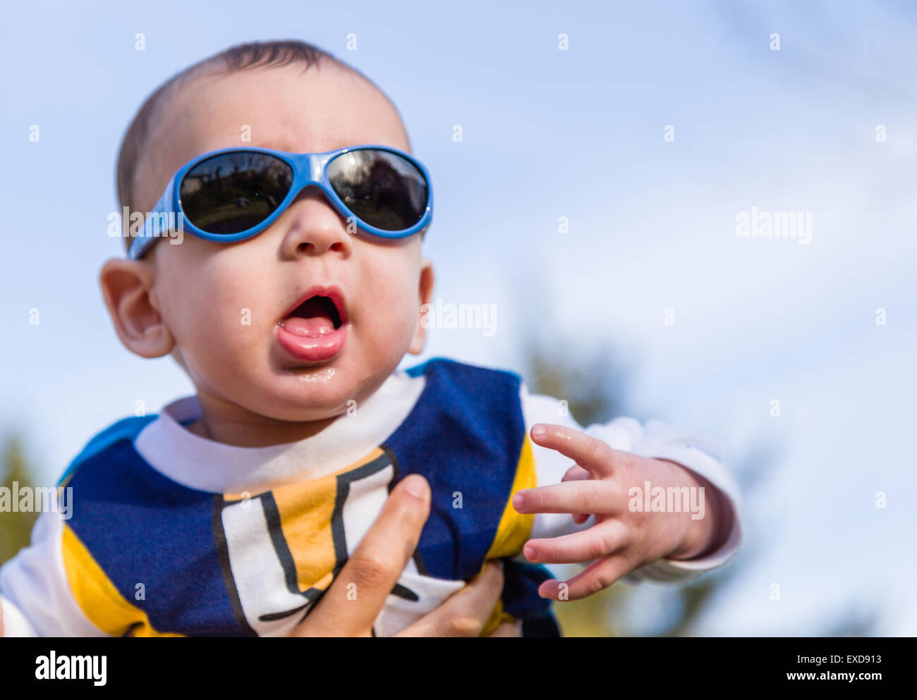 Child wearing blue shirt hi-res stock photography and images - Alamy