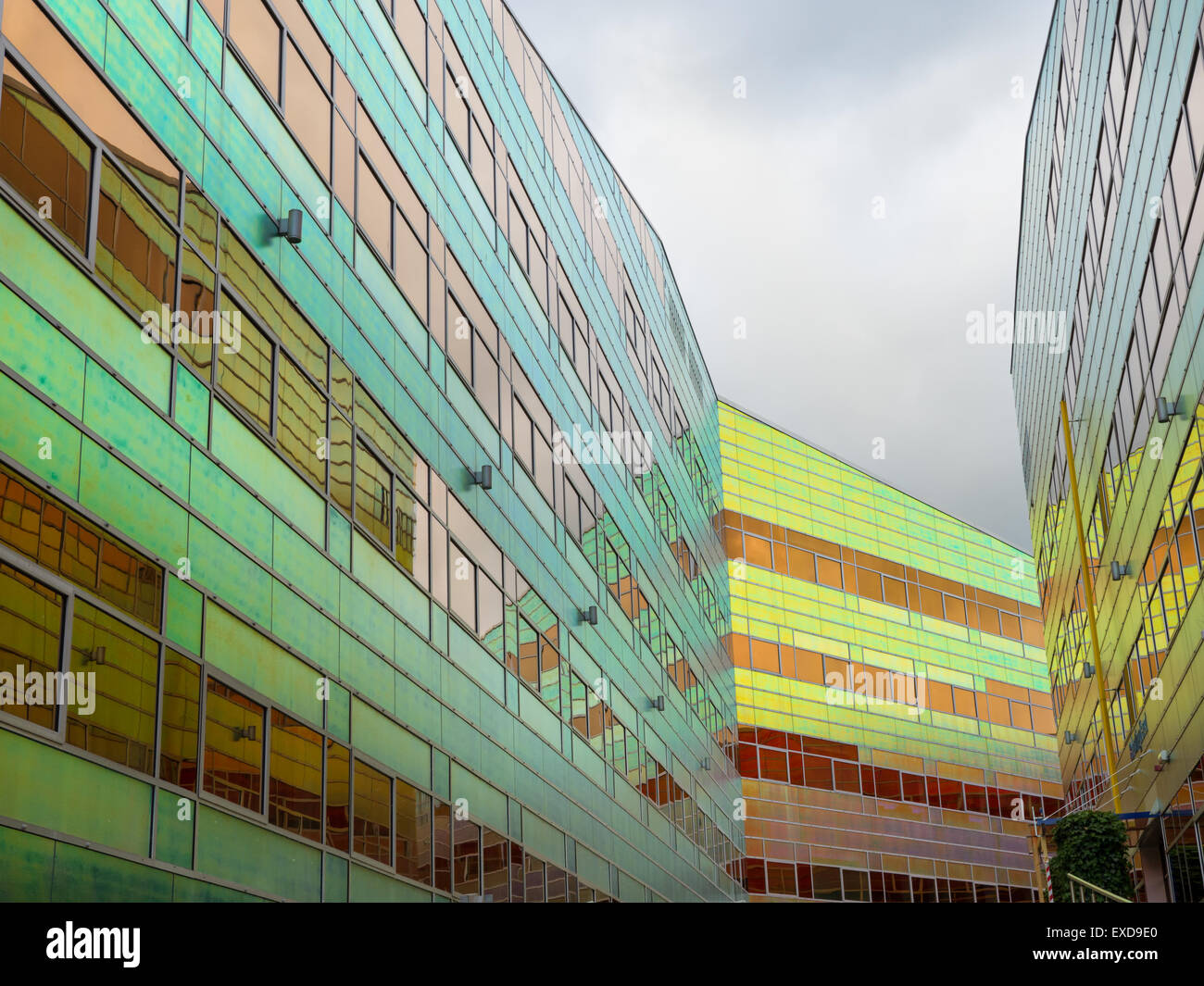 Colorful glass office building in European city Stock Photo - Alamy