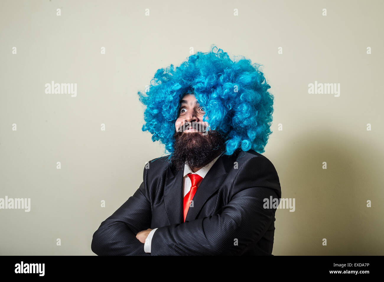 crazy funny bearded man with blue wig on white background Stock Photo ...