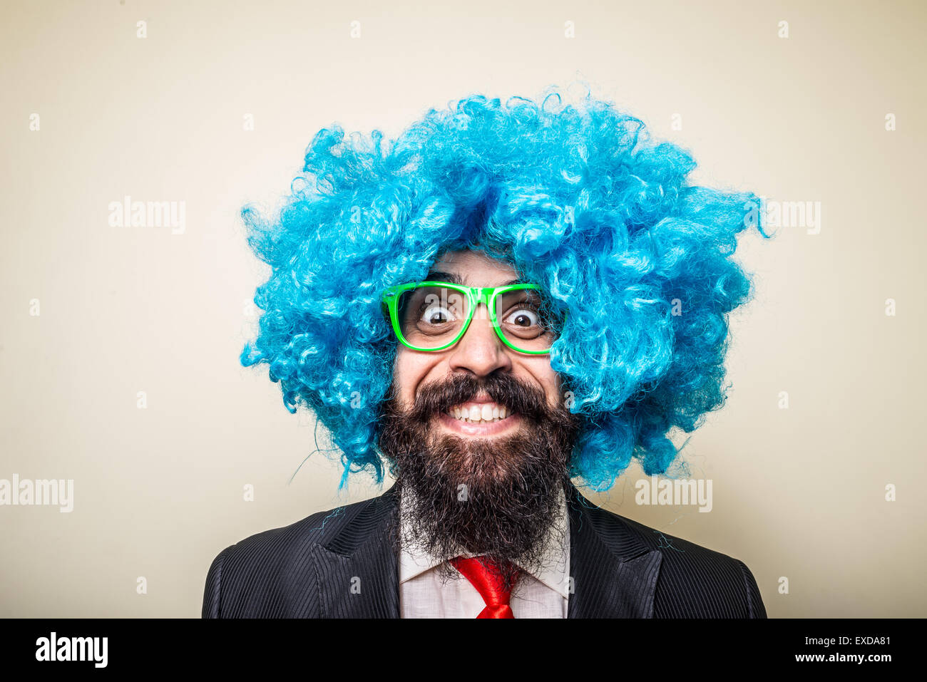 crazy funny bearded man with blue wig on white background Stock Photo ...
