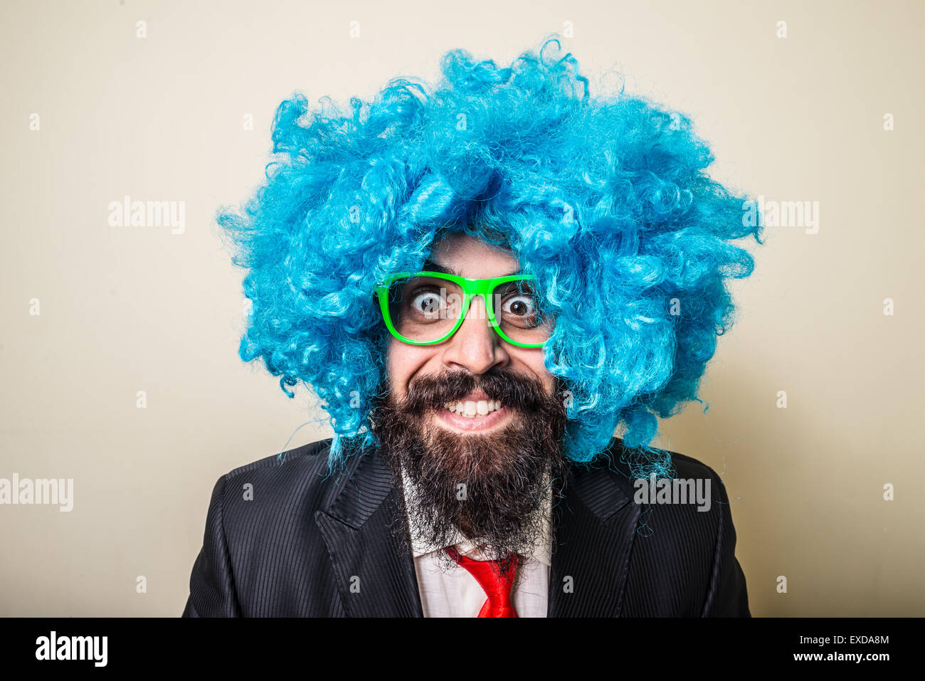 crazy funny bearded man with blue wig on white background Stock Photo ...