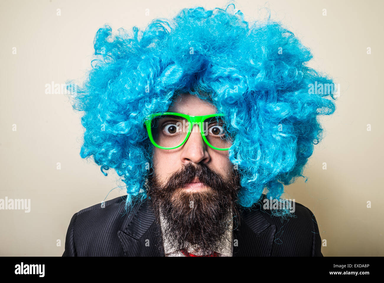 crazy funny bearded man with blue wig on white background Stock Photo ...