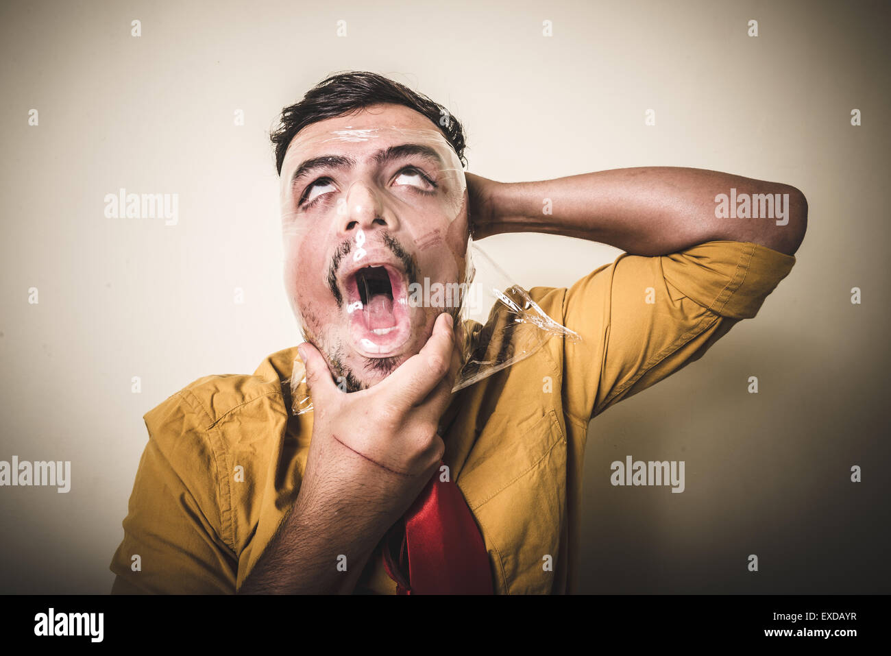 suffocating man with the plastic on white background Stock Photo - Alamy