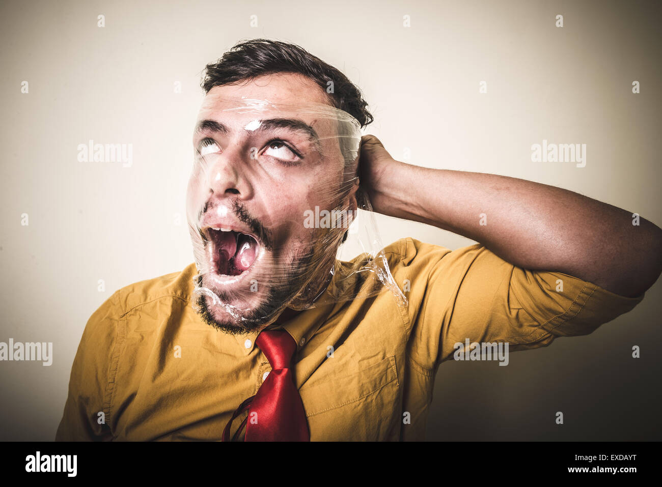 suffocating man with the plastic on white background Stock Photo - Alamy